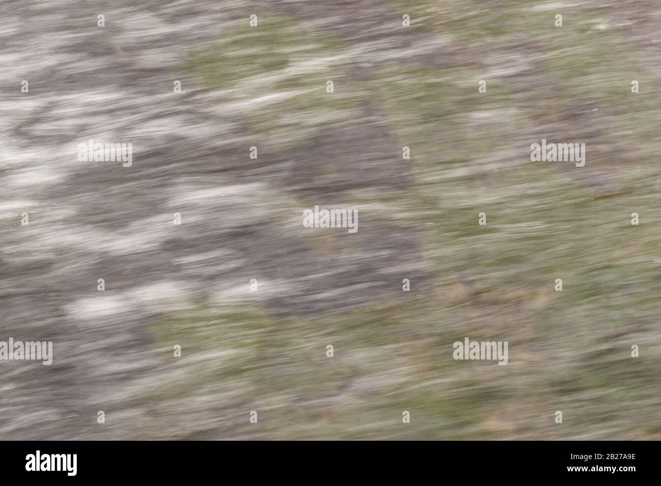 Water blurred and flowing quickly in a wild river Stock Photo - Alamy