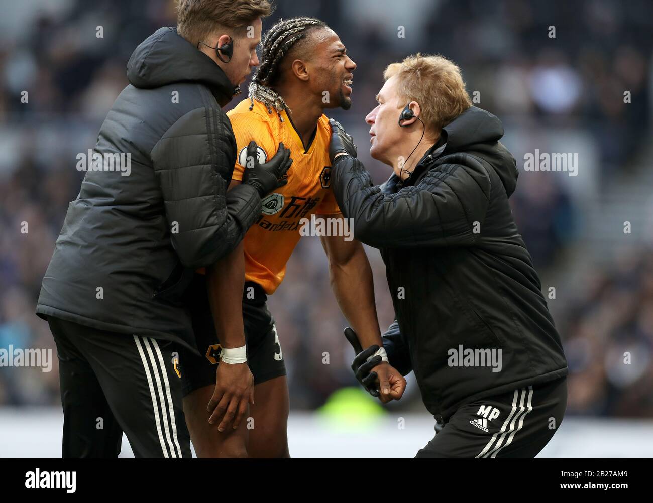 Wolverhampton Wanderers' Adama Traore looks in pain after picking up an ...