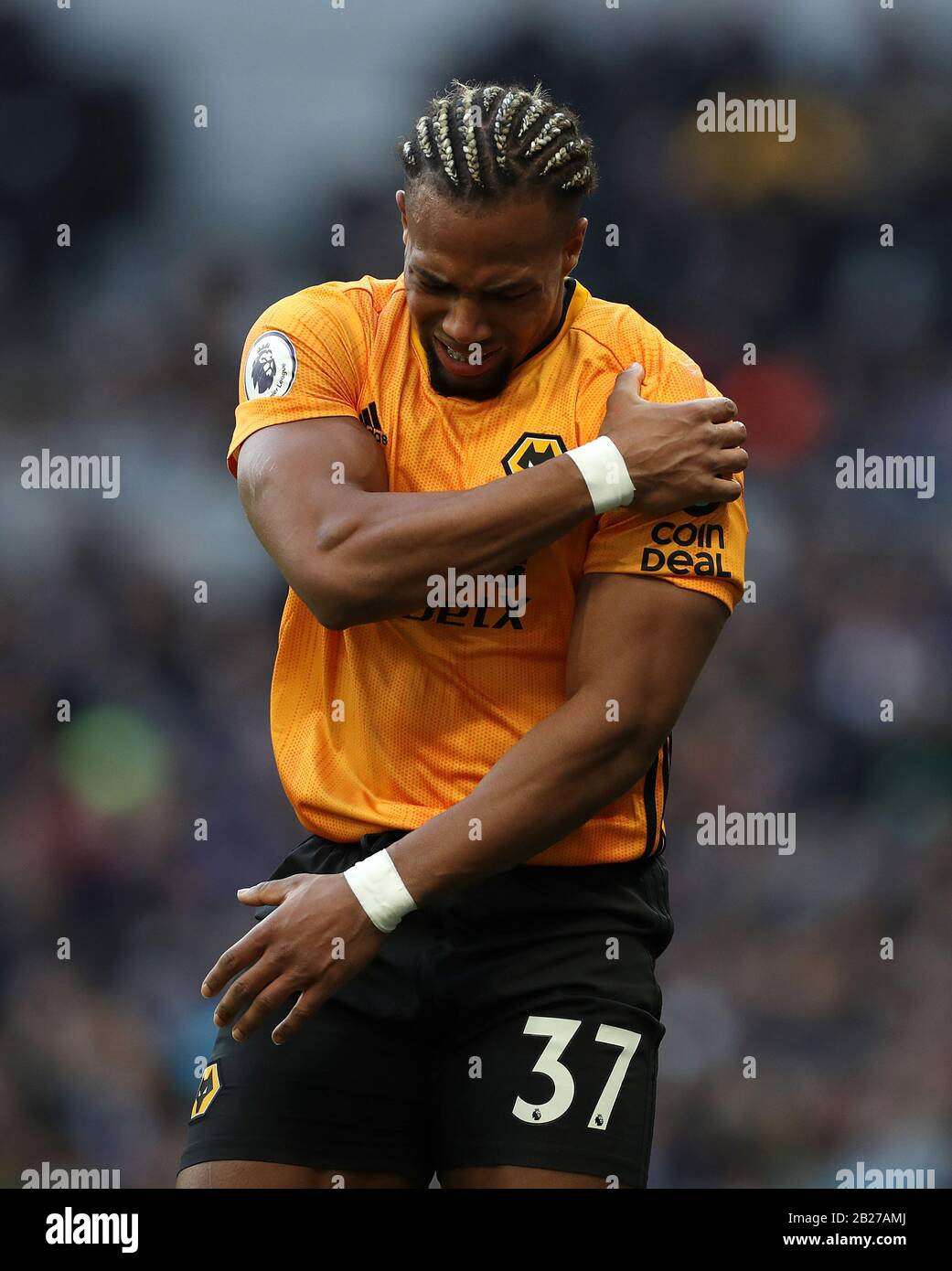 Wolverhampton Wanderers' Adama Traore looks in pain after picking up an ...