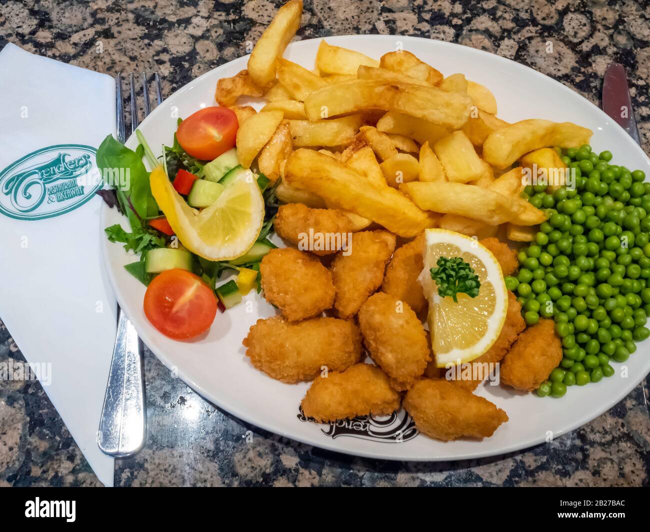 Excellent Scampi and chips at the famous Trenchers Cafe in Whitby Stock ...