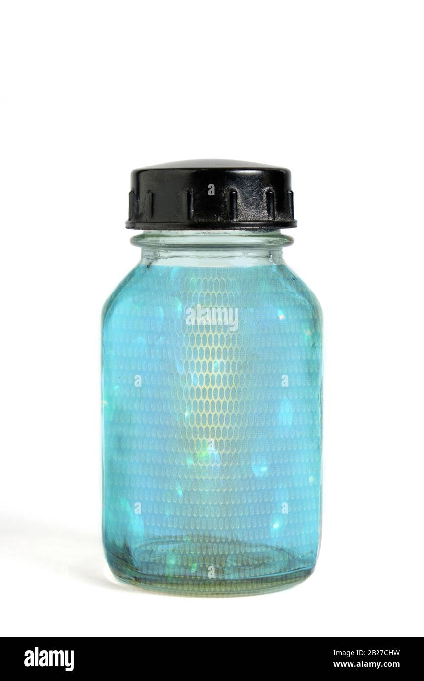 Old bottle with a blue magic liquid inside on a white background Stock ...