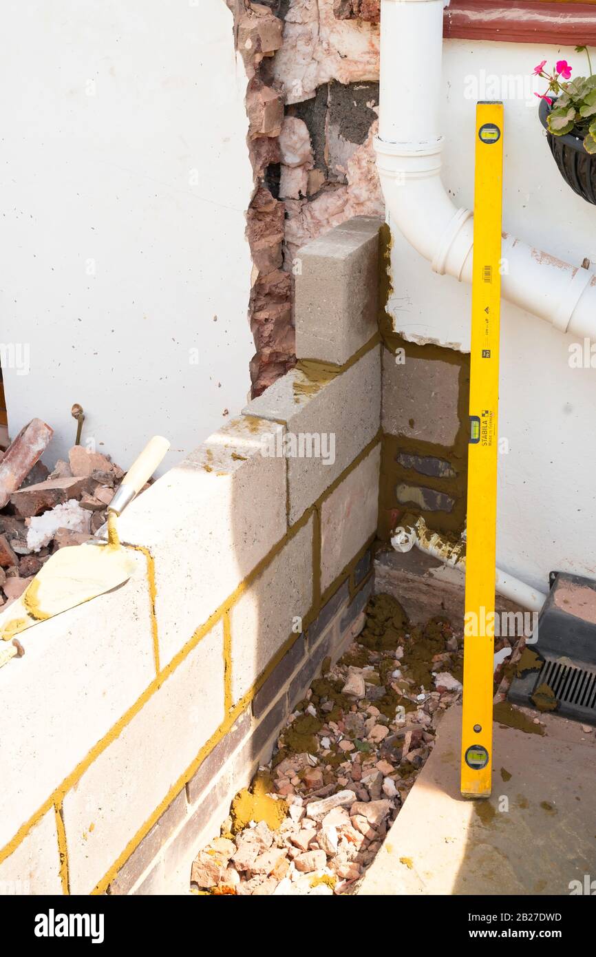 Start brick wall for house extension Stock Photo - Alamy