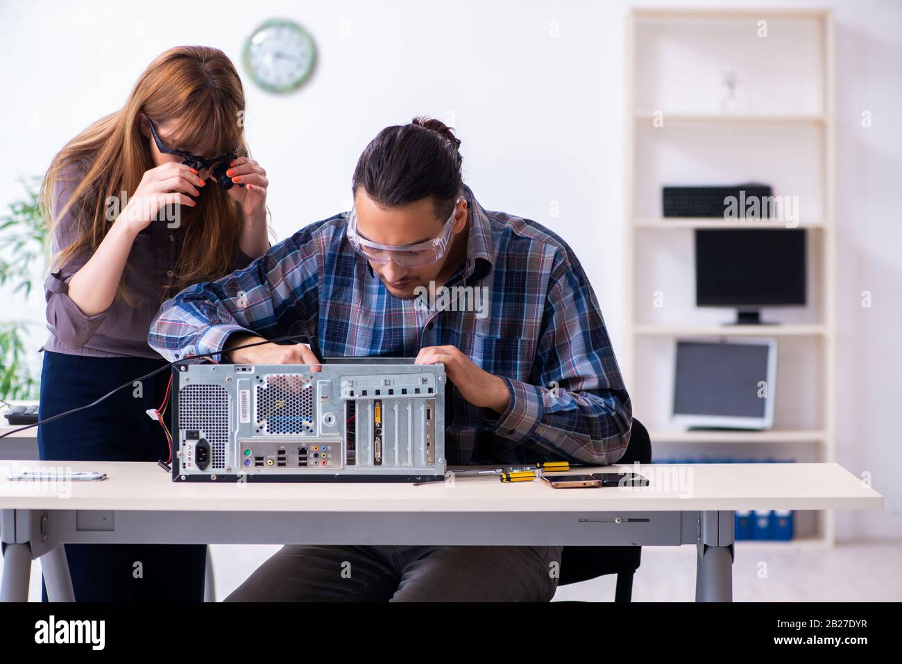 The two repairmen repairing desktop computer Stock Photo - Alamy
