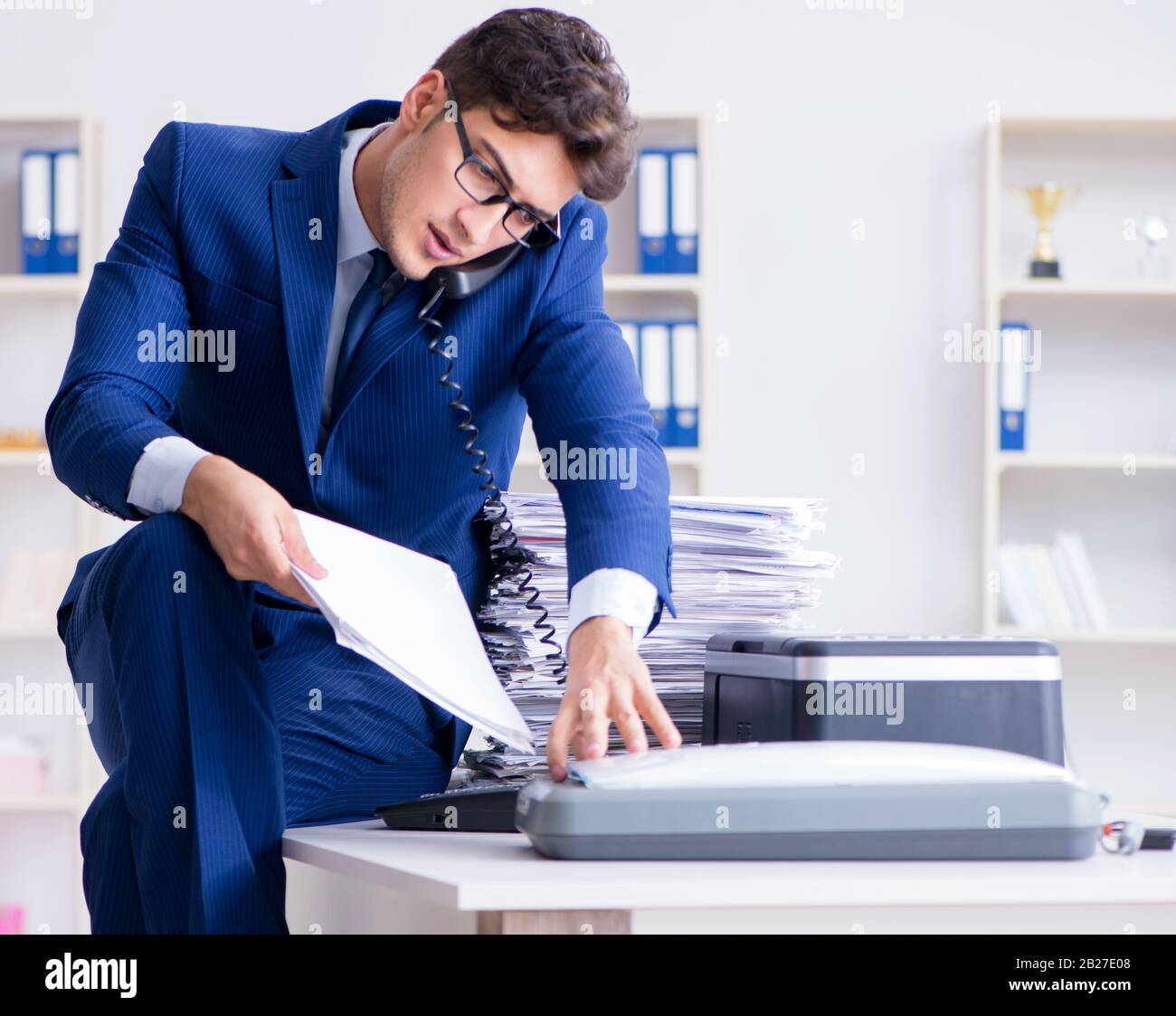 The businessman making copies in copying machine Stock Photo - Alamy