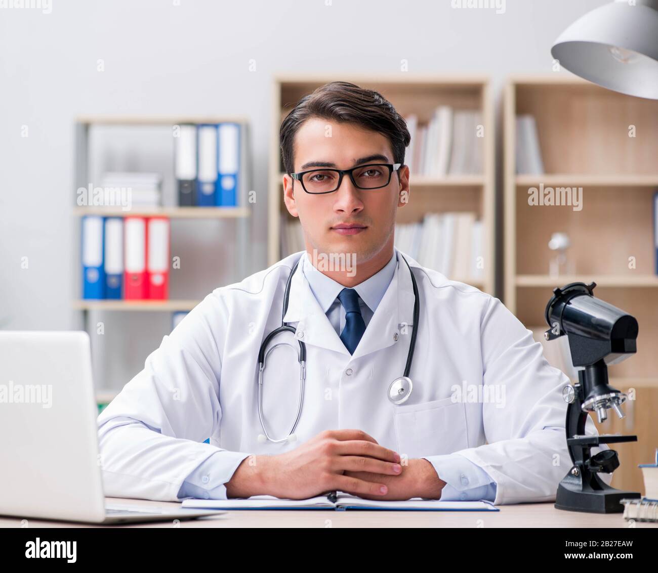 The young adult doctor with laptop computer Stock Photo - Alamy