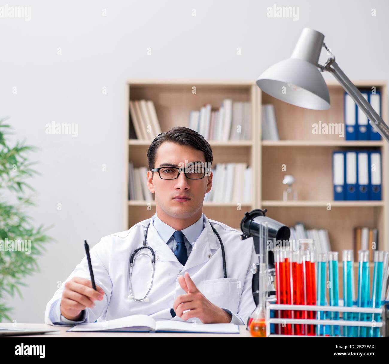 The man doctor working in the lab Stock Photo - Alamy
