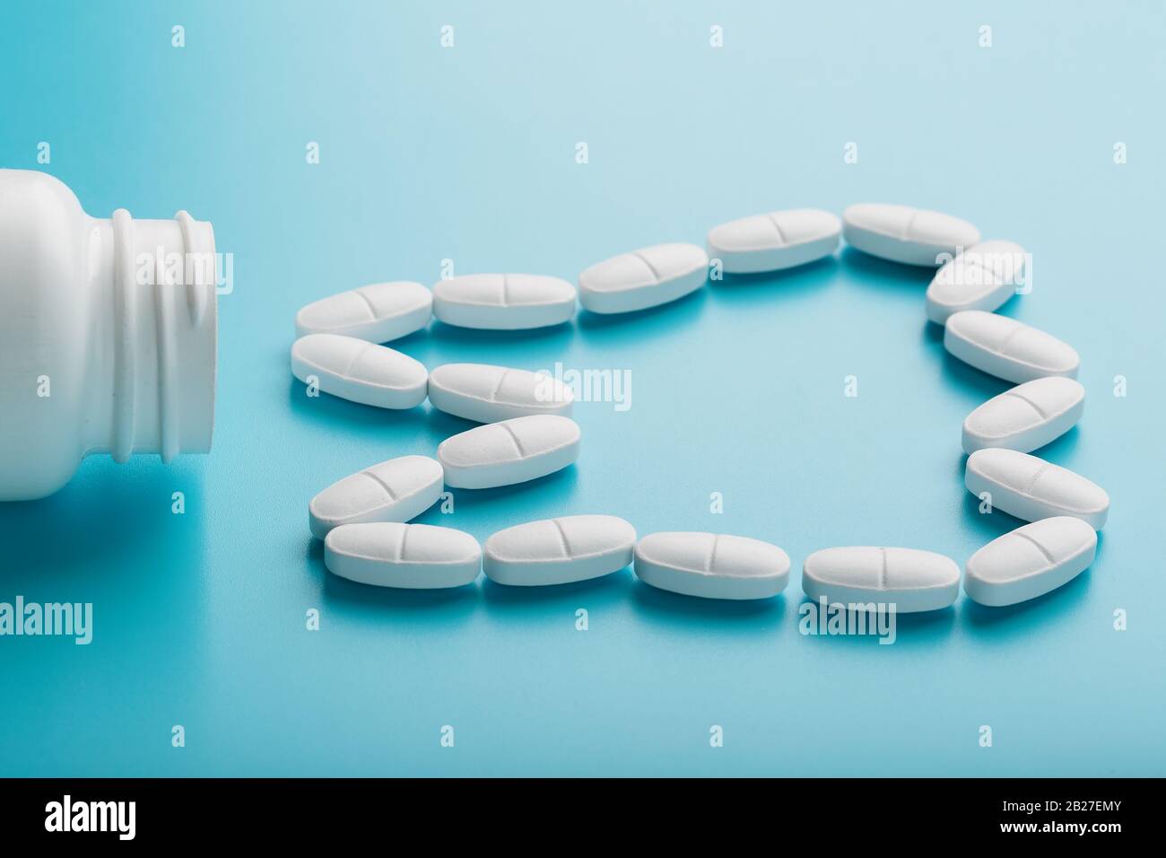 Vitamins with calcium Ca in the form of a tooth are scattered from a ...