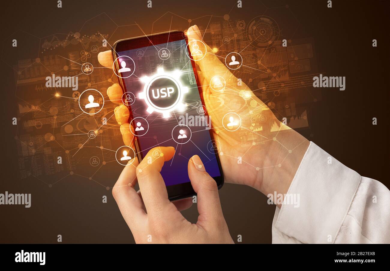 Female hand holding smartphone with USP abbreviation, modern technology ...