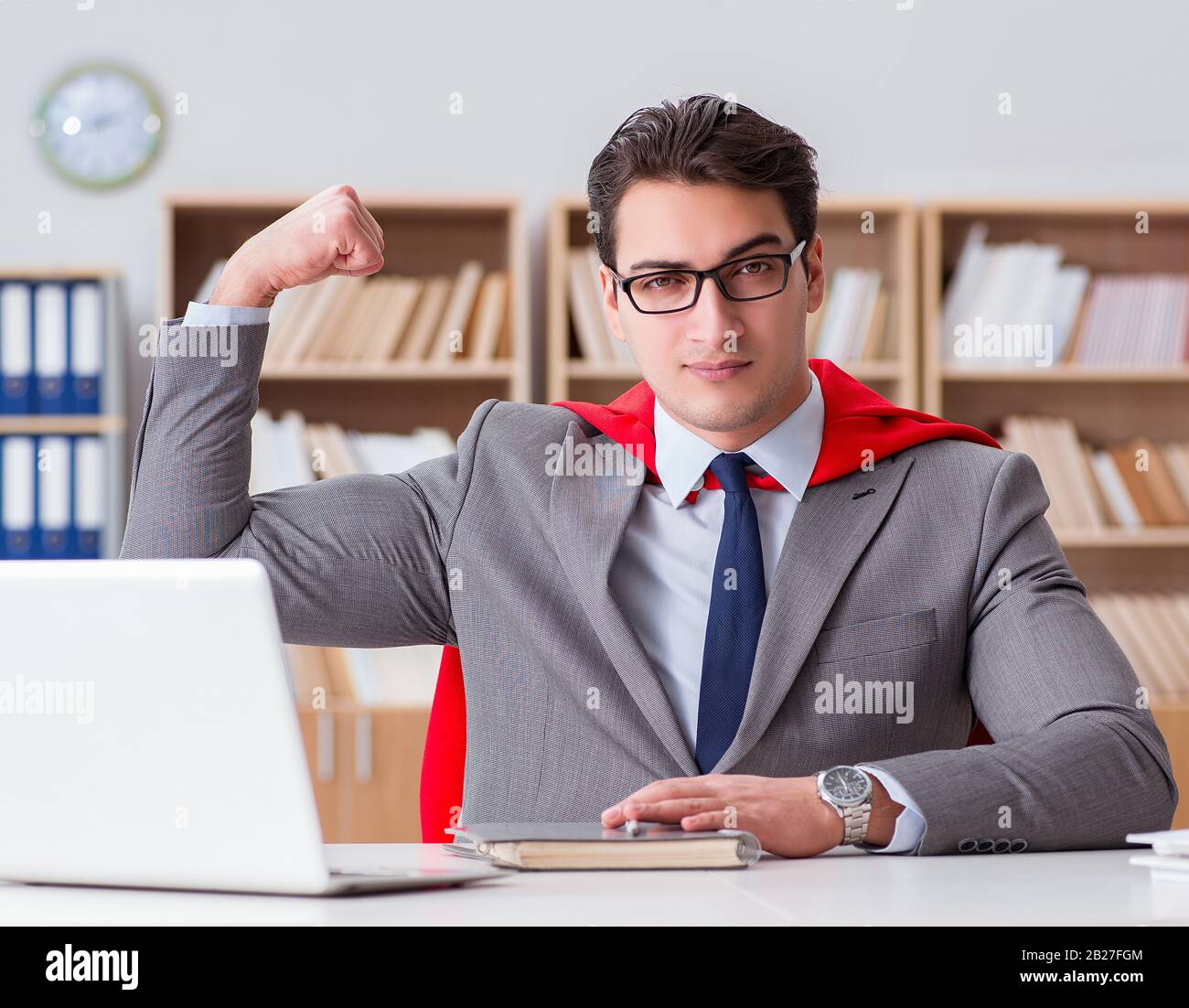 The superhero businessman working in the office Stock Photo - Alamy