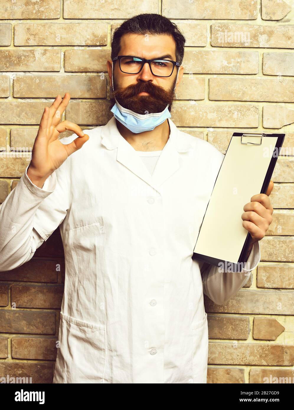 Bearded man, long beard. Brutal caucasian doctor or unshaven hipster ...