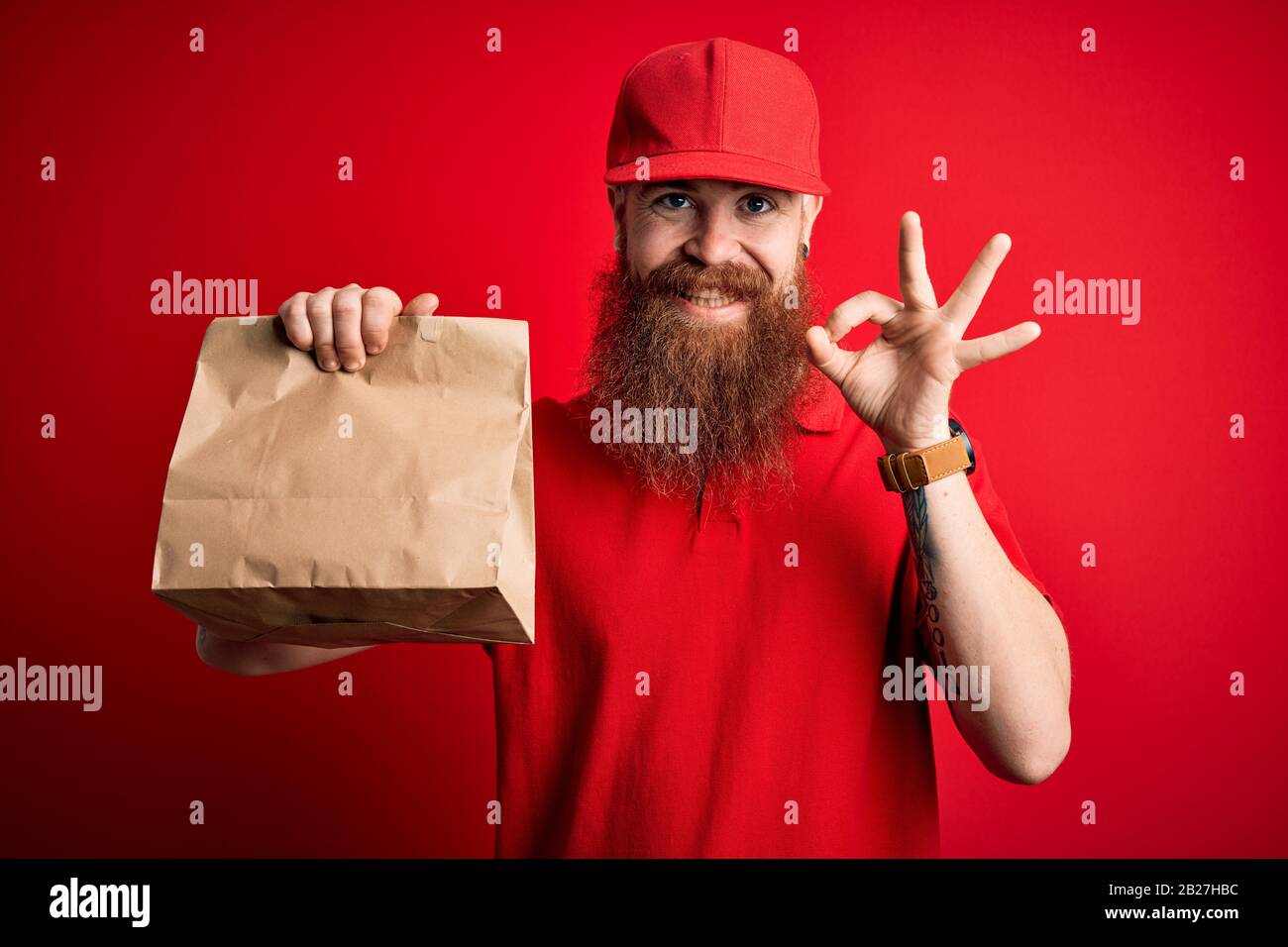 Redhead Irish Delivery Man With Beard Holding Takeaway Paper Bag Over