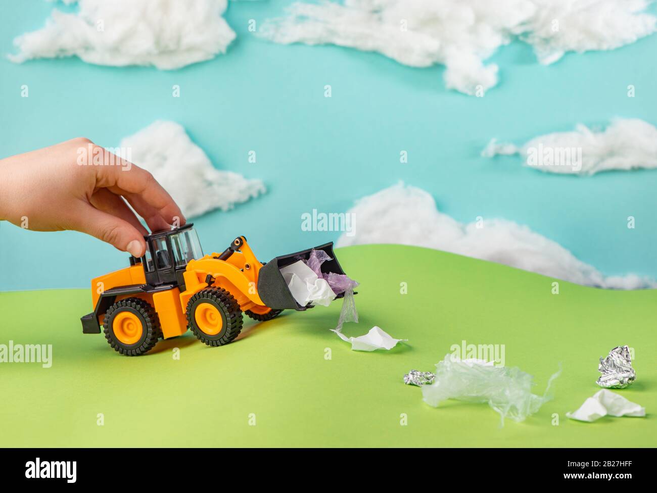 Child picking garbage hi-res stock photography and images - Alamy