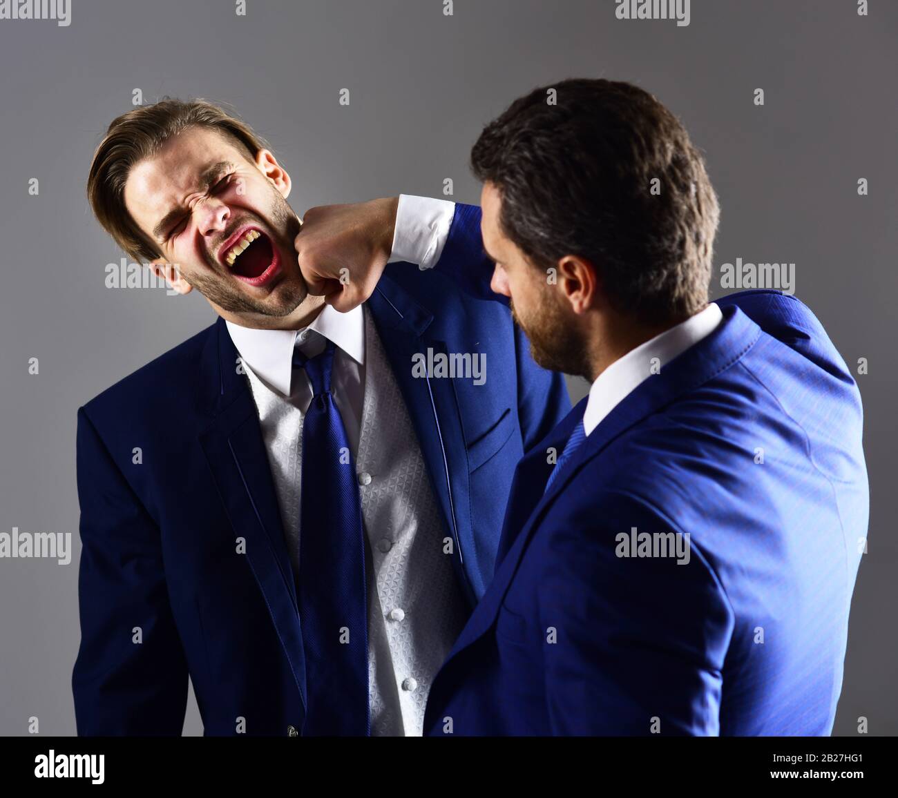 Conflict of interest, business conflict, business fight. Men in suits ...