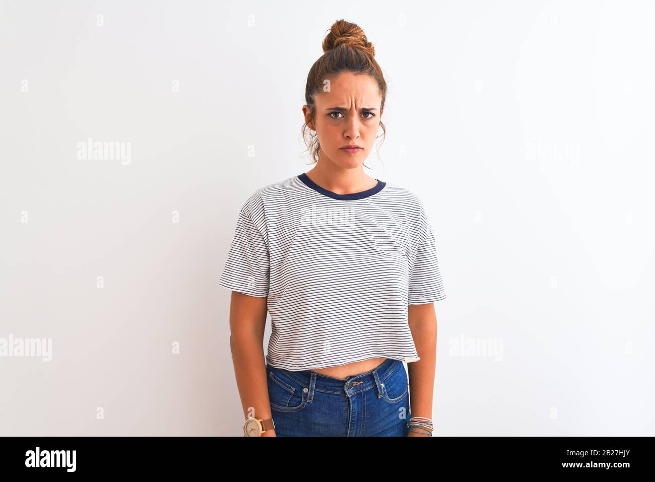 Young redhead modern woman wearing a bun over isolated background ...