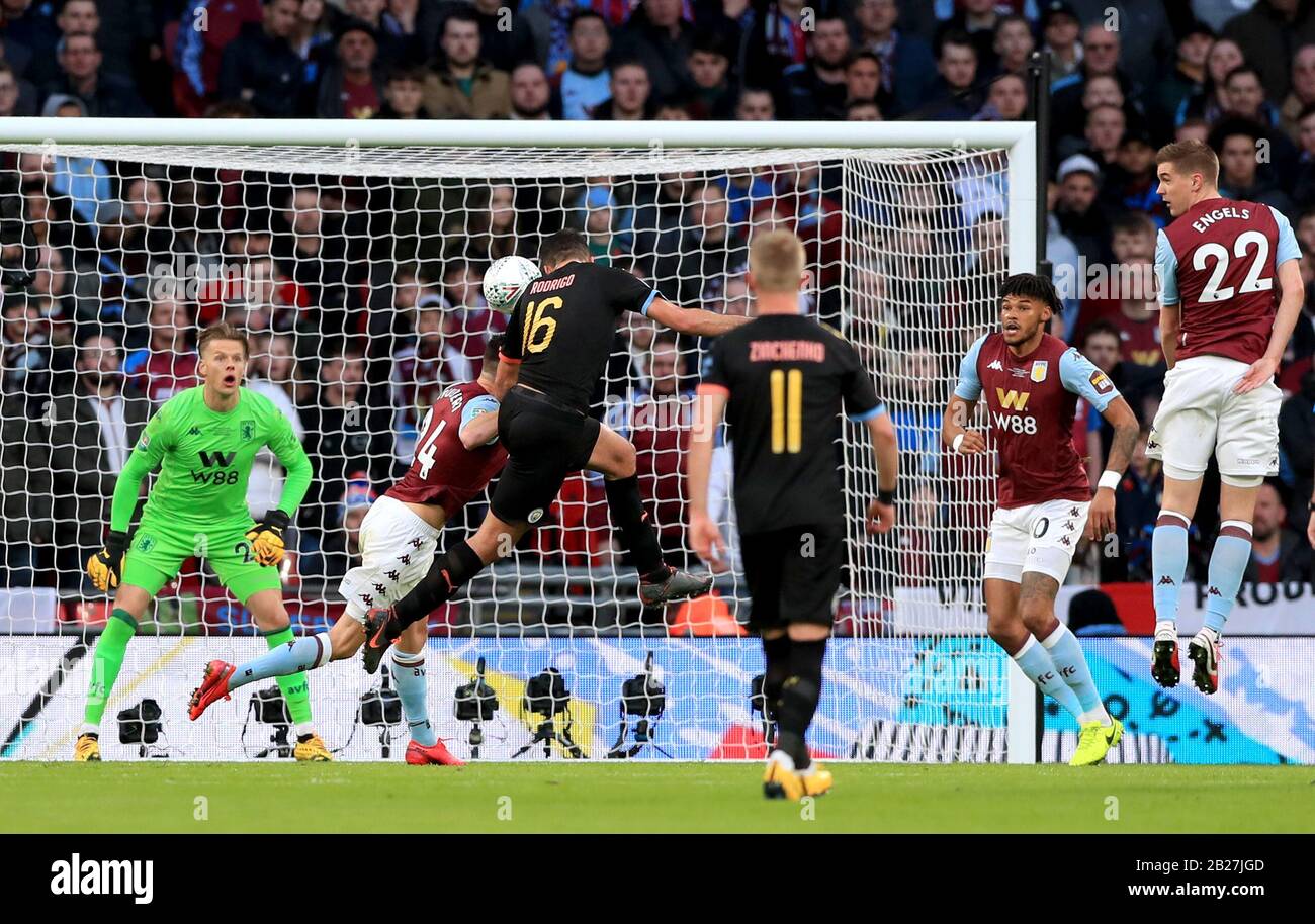 Manchester City's Rodri (third left) scores his side's second goal of ...