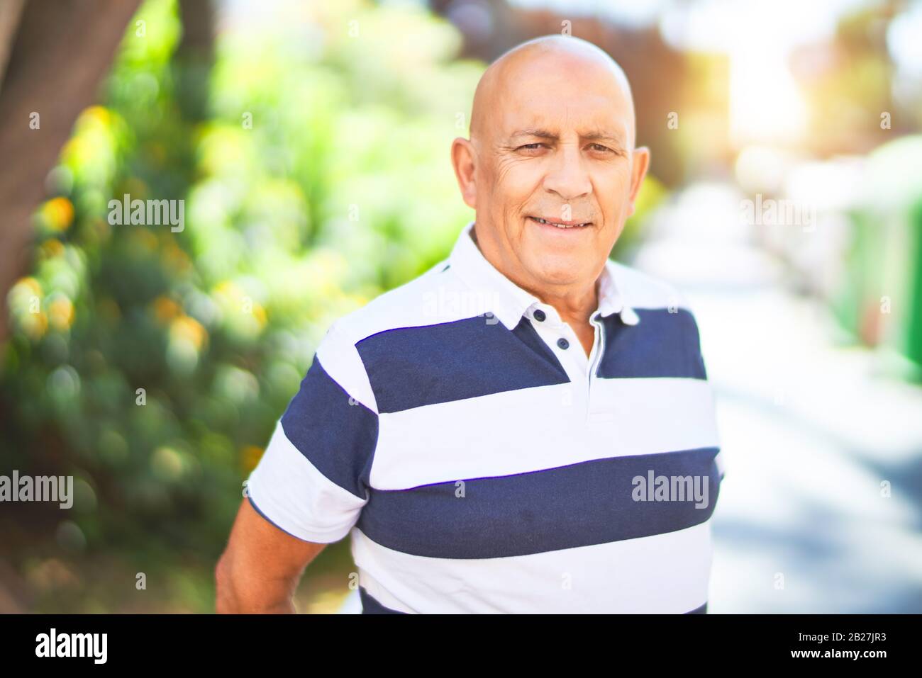 Senior handsome man smiling happy and confident. Standing with smile on ...