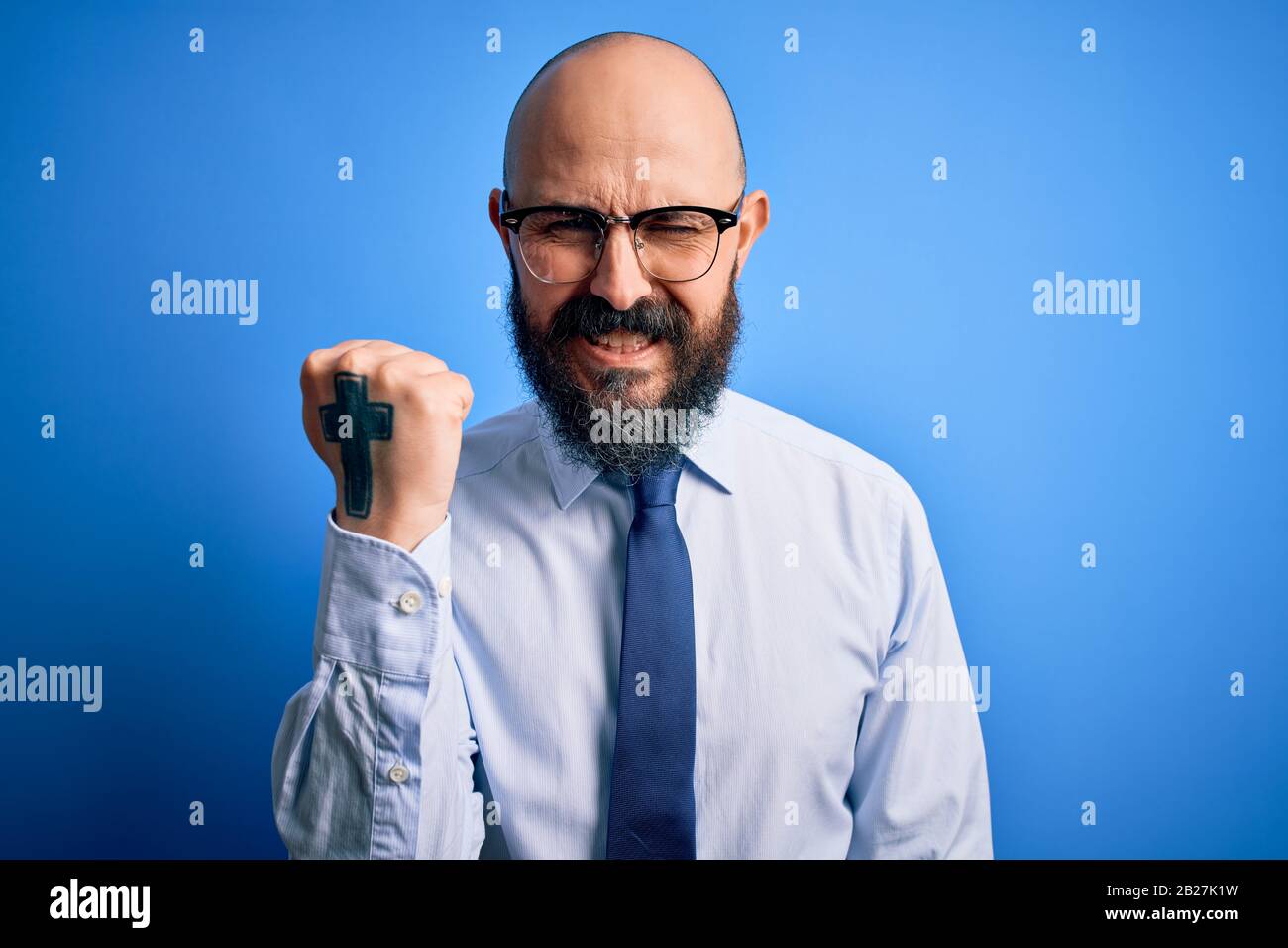 Handsome business bald man with beard wearing elegant tie and glasses ...