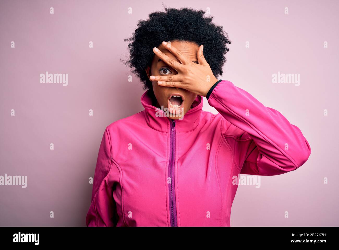 Young African American afro sportswoman with curly hair wearing ...