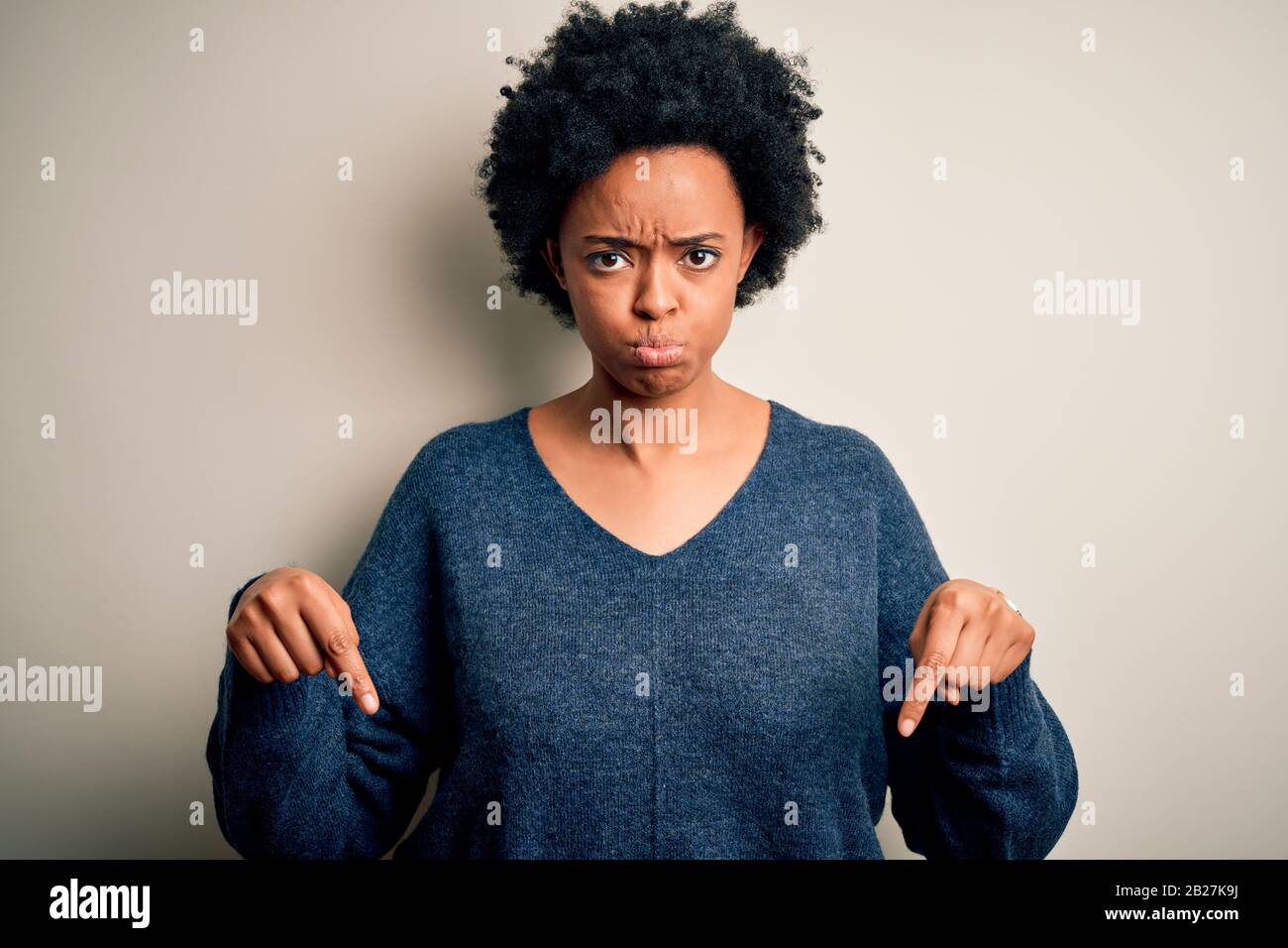 Young beautiful African American afro woman with curly hair wearing ...