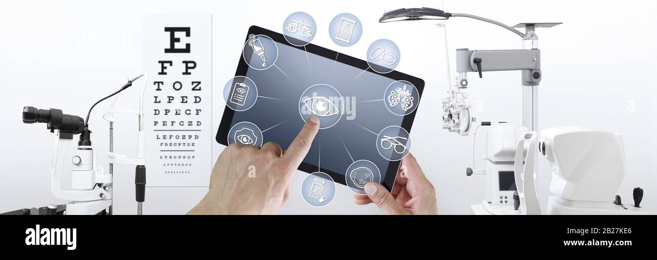 hands touch screen of digital tablet with ophthalmologist and ...