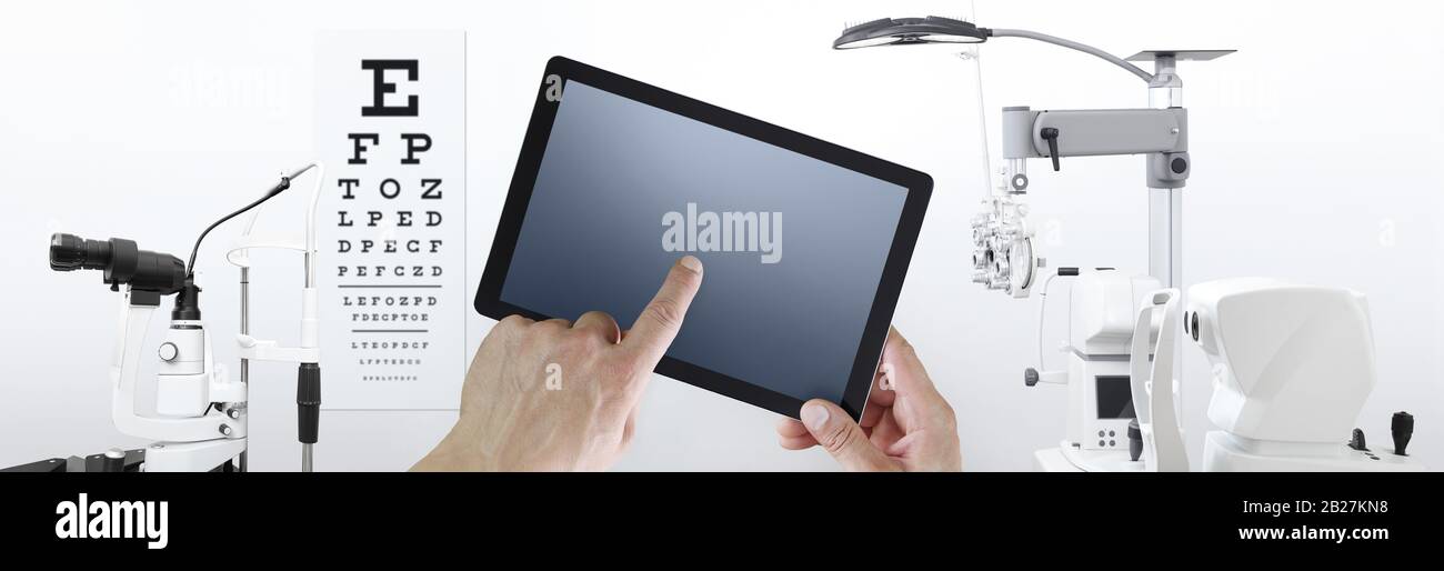 eye examination test concept, hands touch screen of digital tablet ...