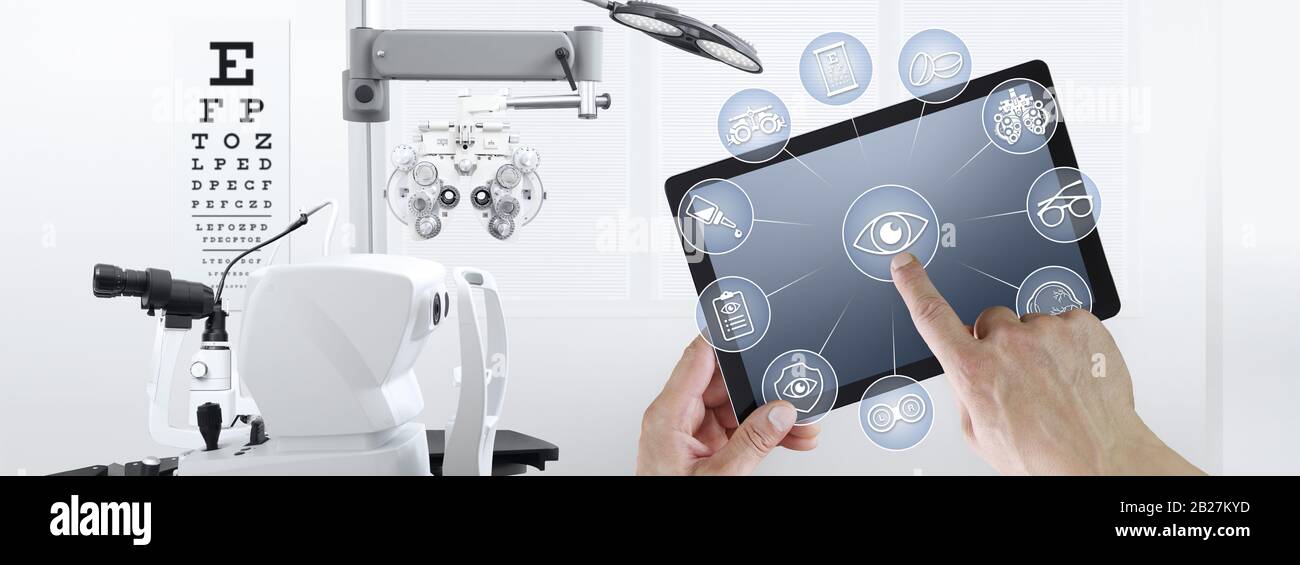 hands touch screen of digital tablet with ophthalmologist and ...
