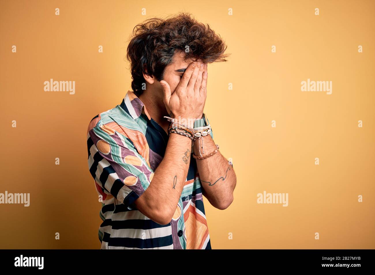 Young handsome man on vacation wearing summer shirt over isolated ...