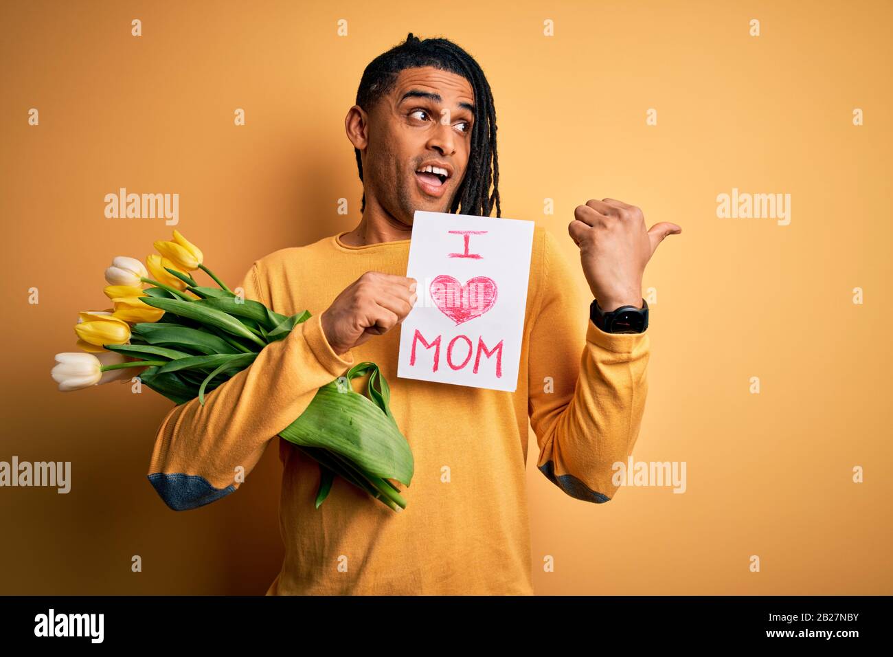 African american man holding love mom message paper and tulips ...