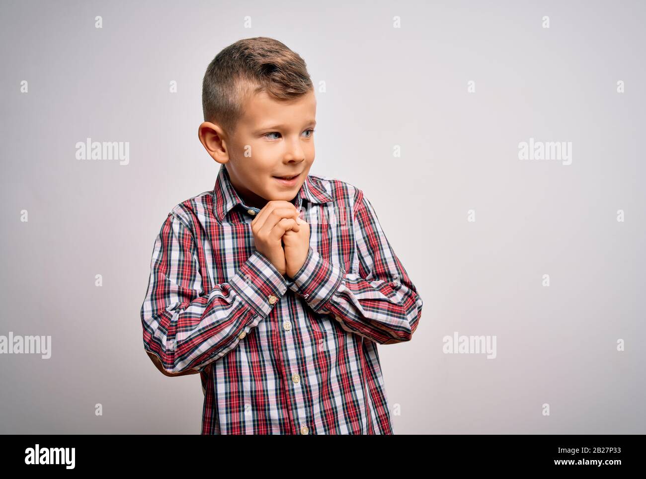 Young little caucasian kid with blue eyes wearing elegant shirt ...