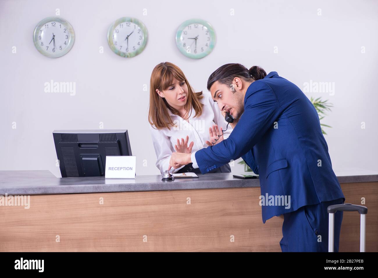 The young businessman at hotel reception Stock Photo - Alamy