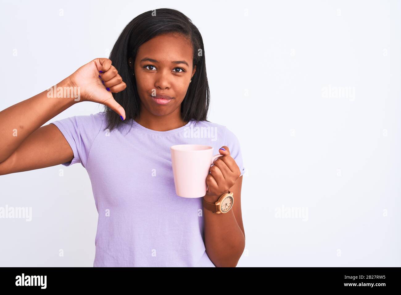 Young african american woman drinking a cup of coffee over isolated ...