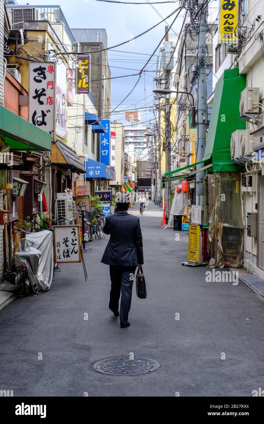Man walks from business building hi-res stock photography and images ...