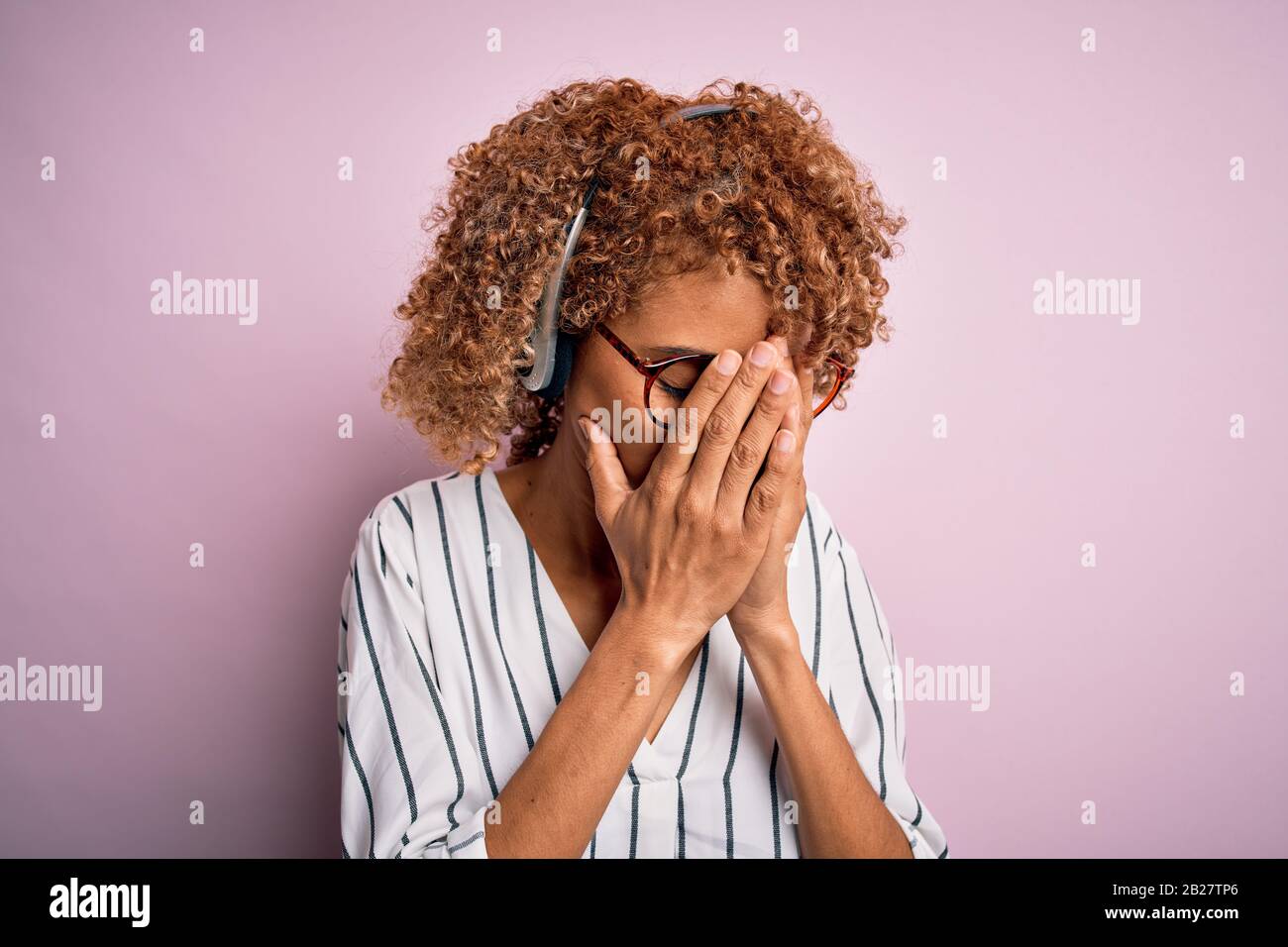 African american curly call center agent woman working using headset ...