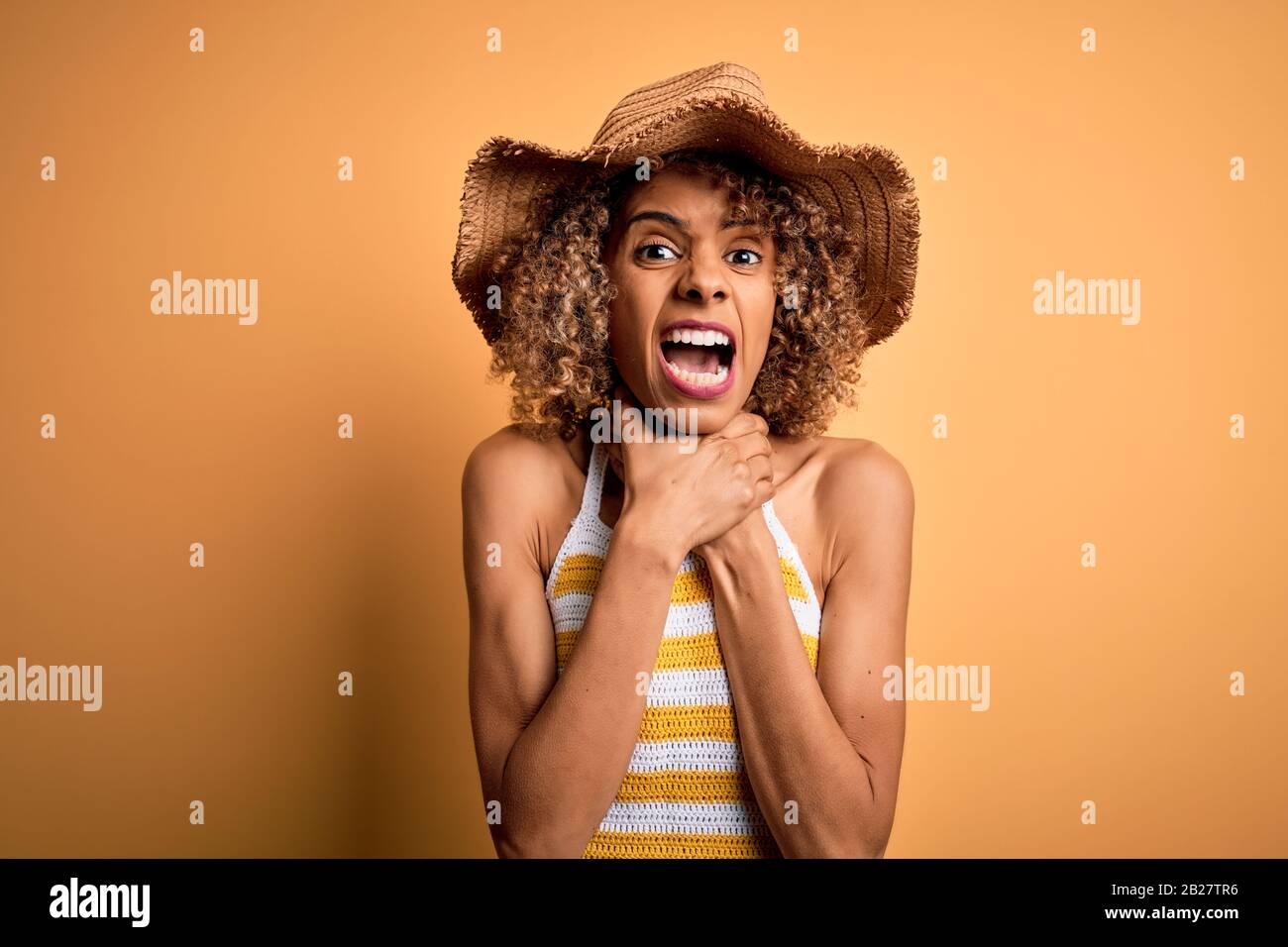 African american tourist woman with curly on vacation wearing summer ...