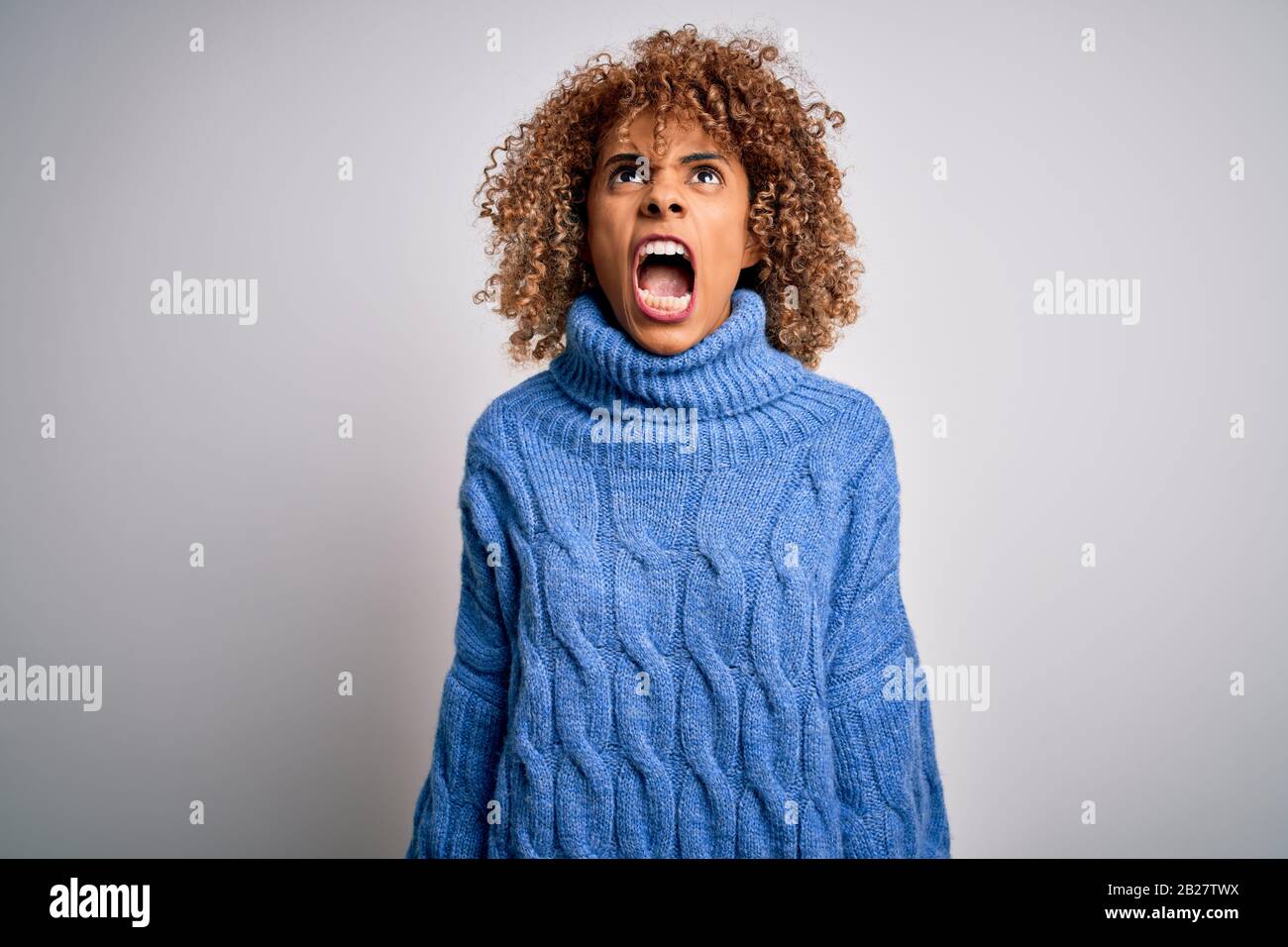 Young beautiful african american woman wearing turtleneck sweater over ...