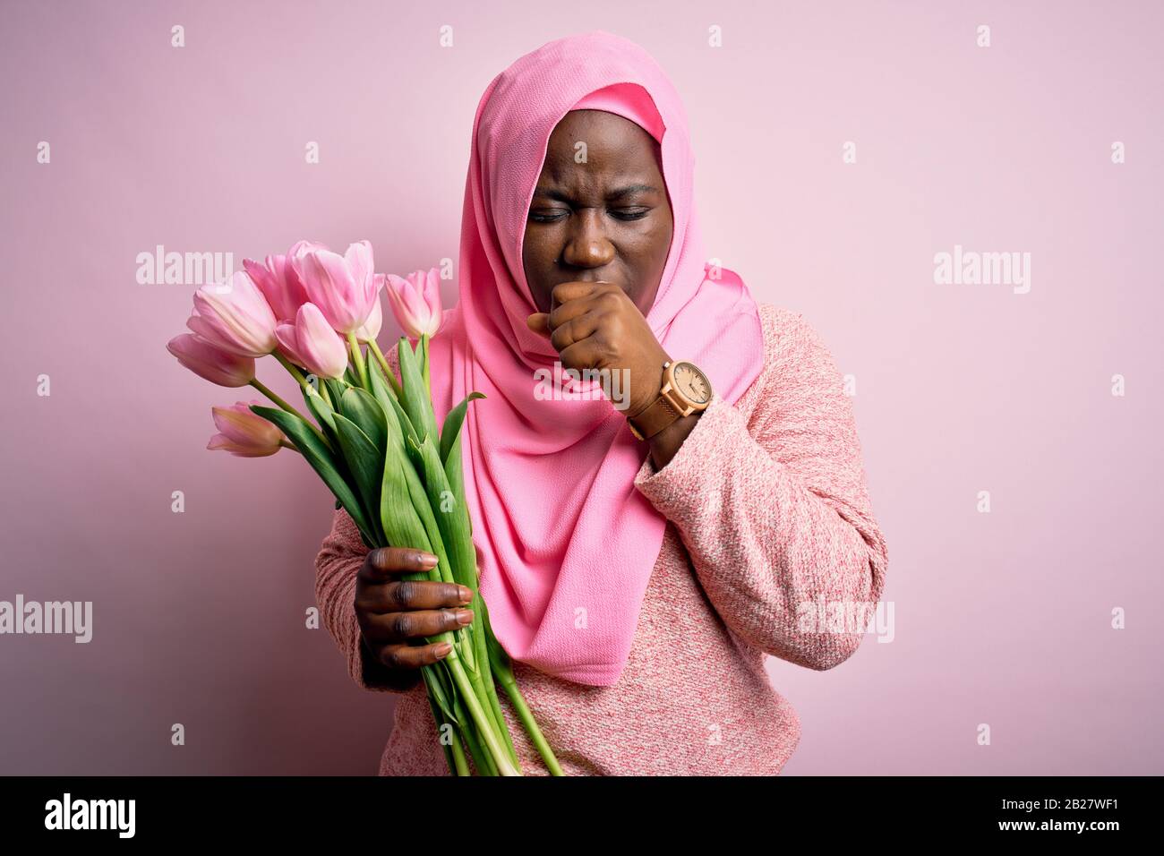 Young african american plus size woman wearing muslim hijab holding ...