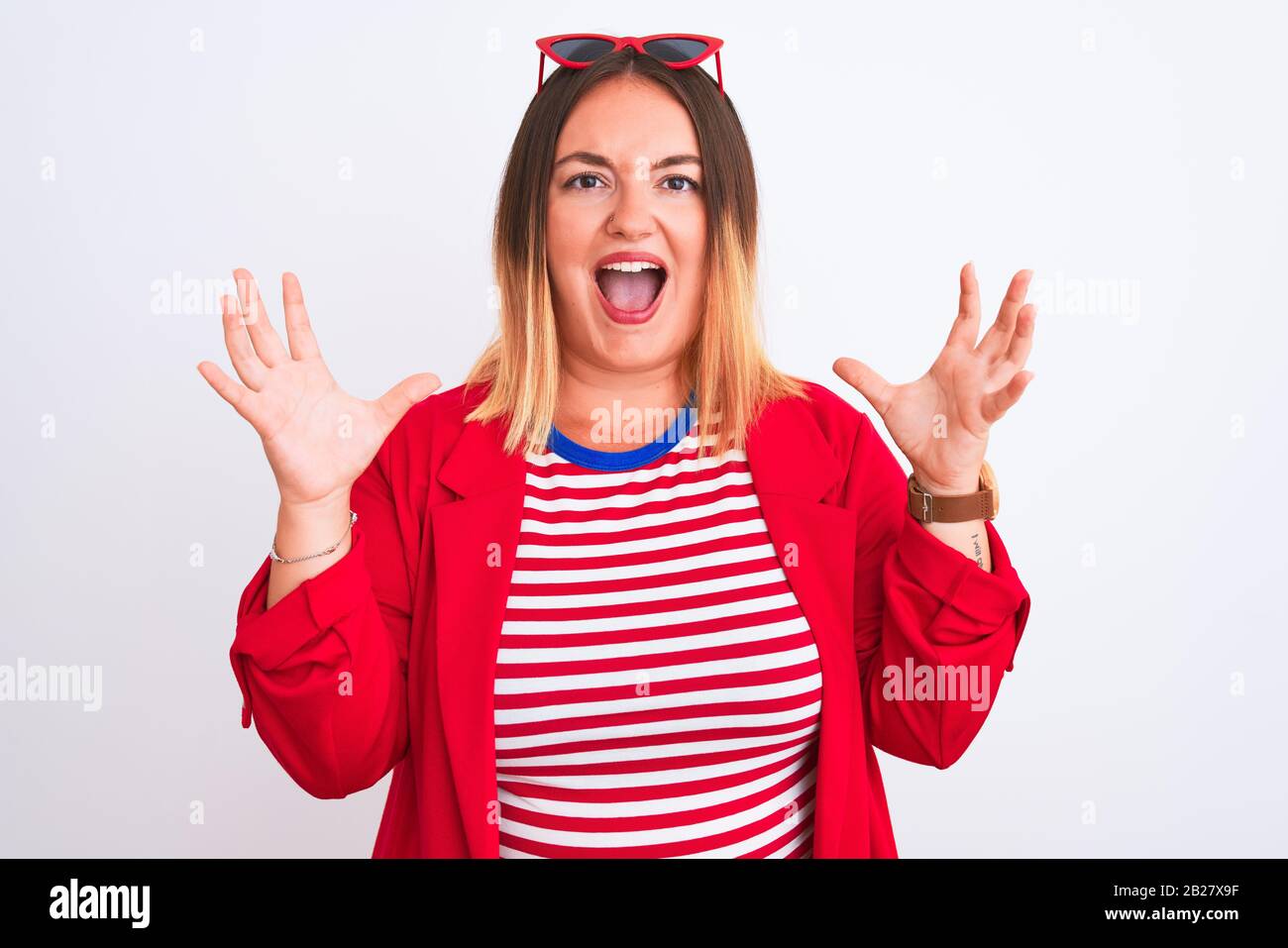 Young Beautiful Woman Wearing Striped T Shirt And Jacket Over Isolated