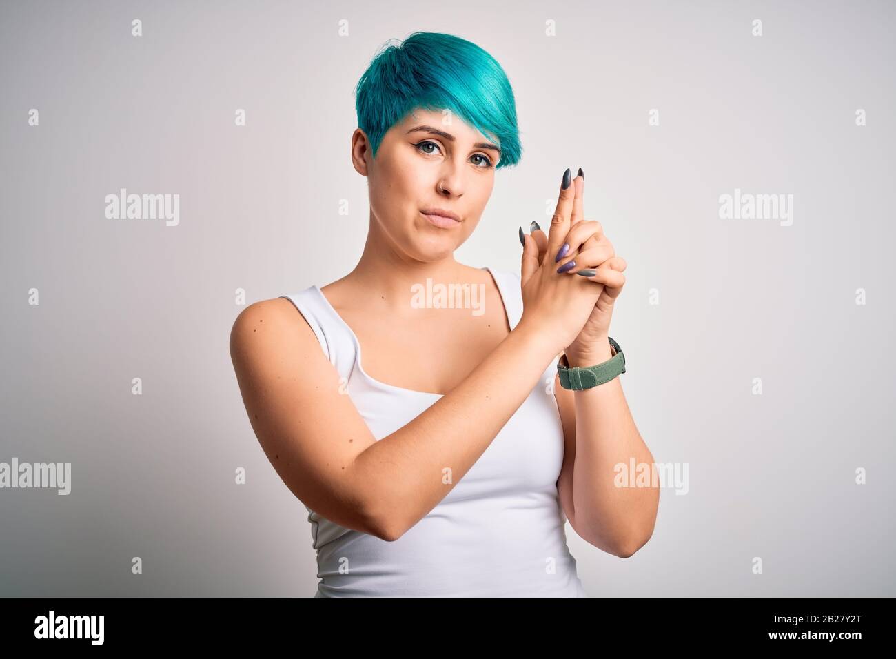 Young beautiful woman with blue fashion hair wearing casual t-shirt ...