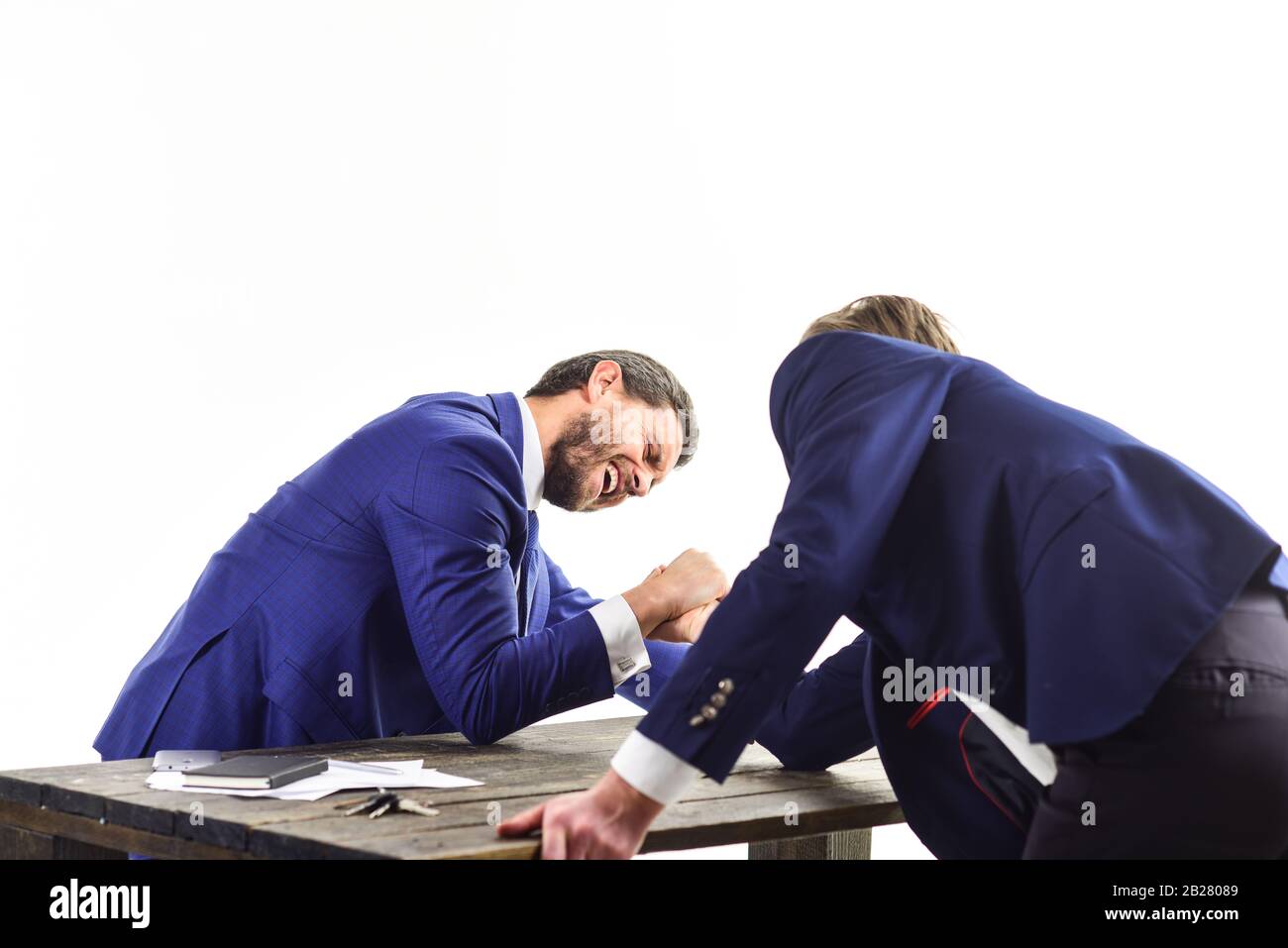Men in suit, businessmen with screaming face compete in armwrestling ...