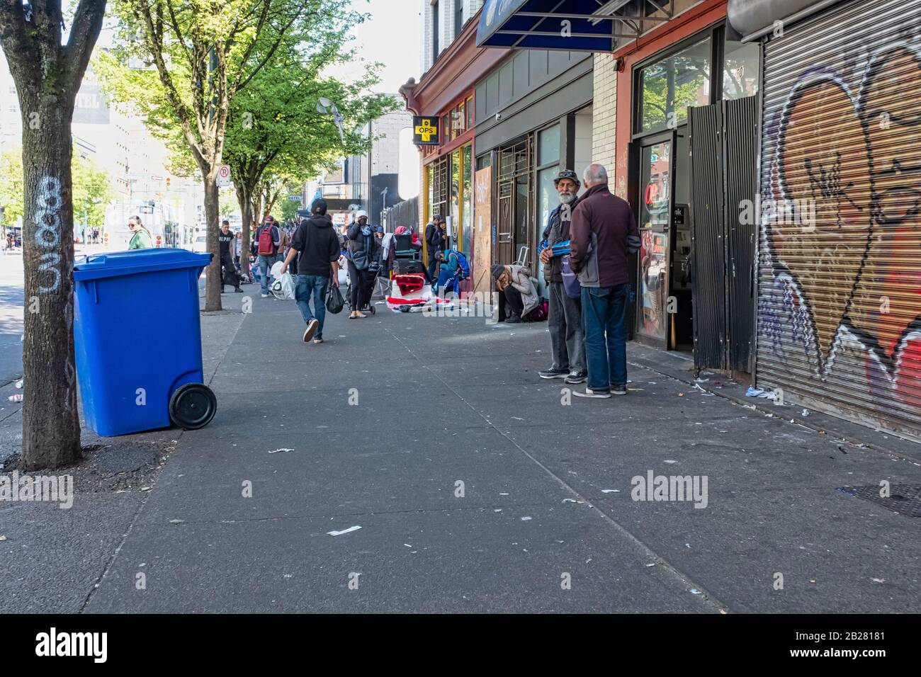 Homeless man laying sidewalk hi-res stock photography and images - Alamy