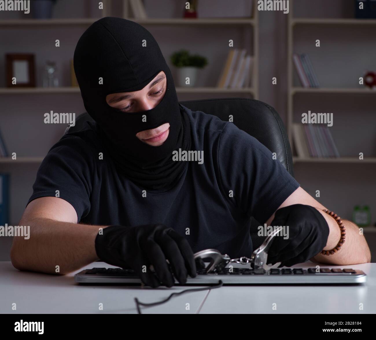 The hacker hacking computer late at night Stock Photo - Alamy