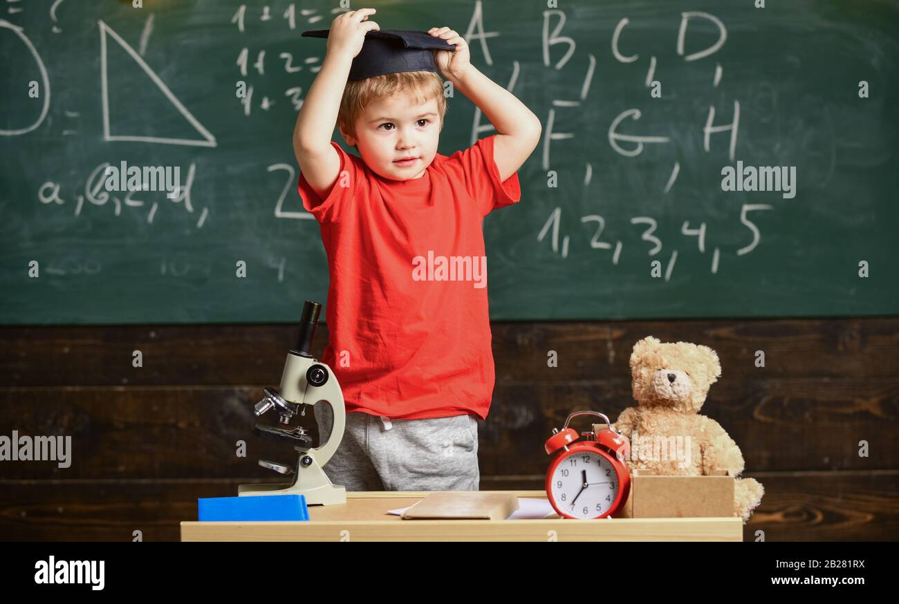 Kindergarten graduation concept. Kid boy in graduate cap ready to go to ...