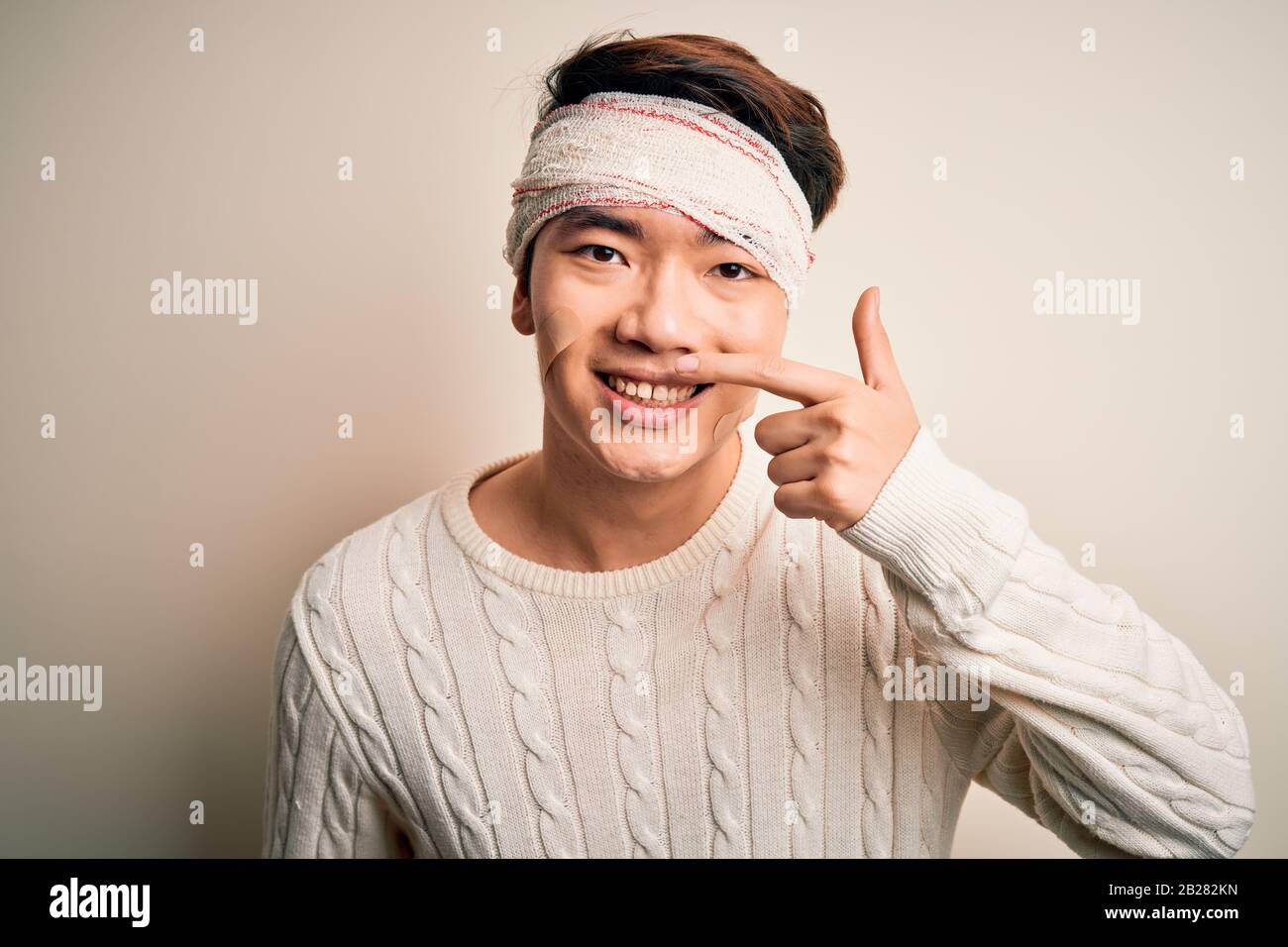 Young handsome chinese man injured for accident wearing bandage and ...