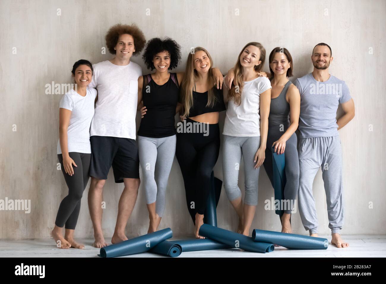 Group of multi-ethnic slim people photo shooting after workout Stock ...