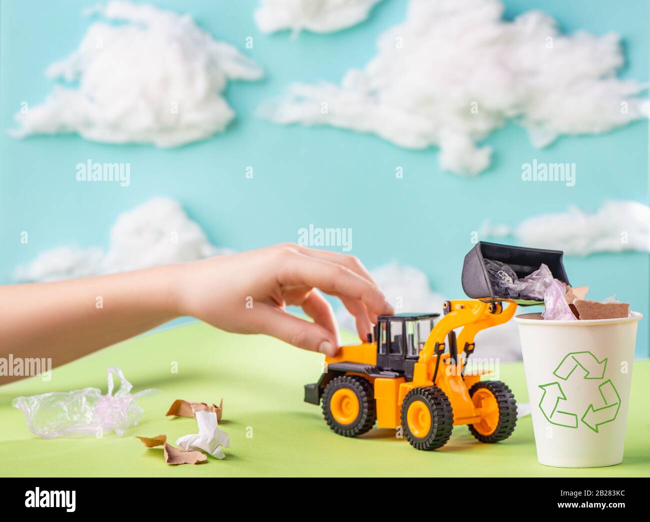 Child playing with a toy truck and loading garbage Stock Photo - Alamy