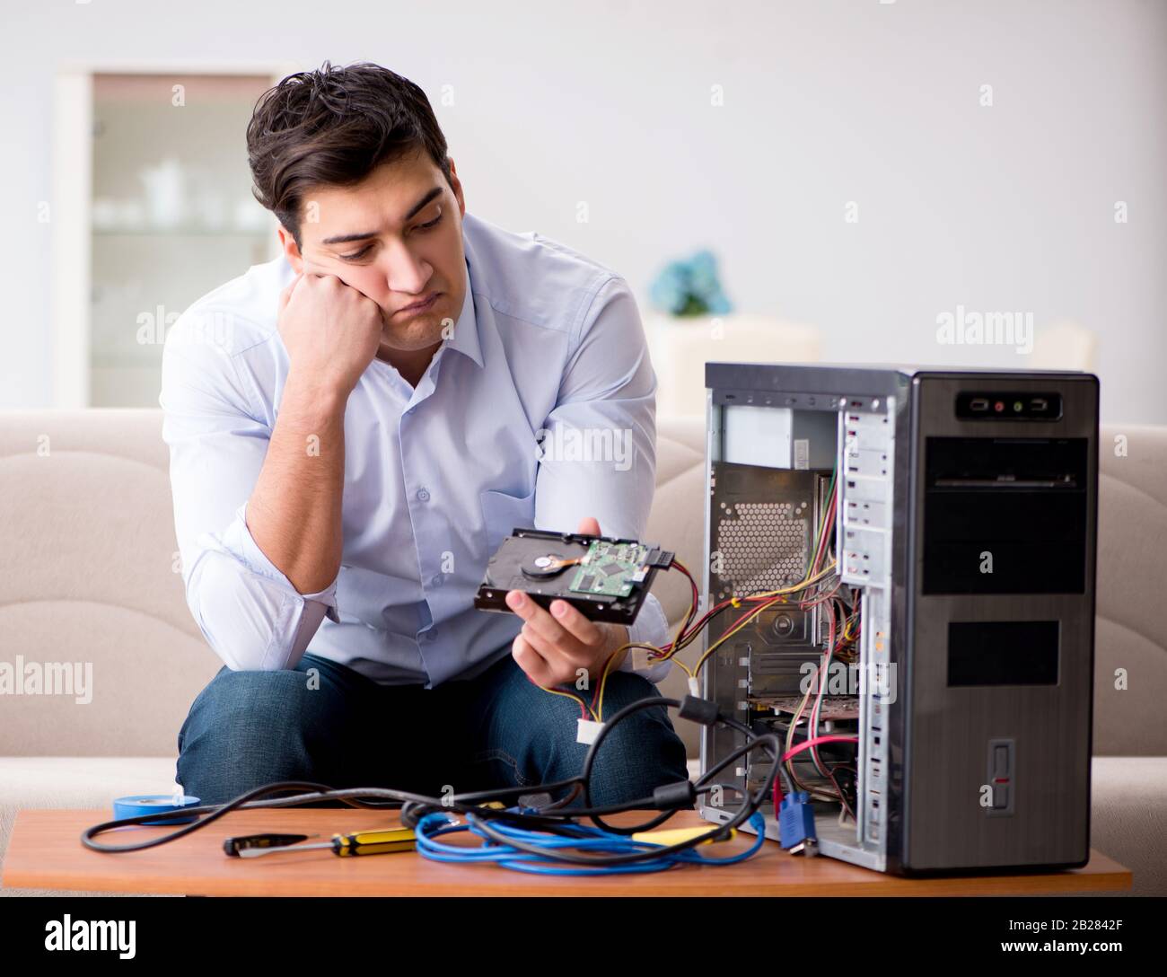The frustrated man with broken pc computer Stock Photo - Alamy