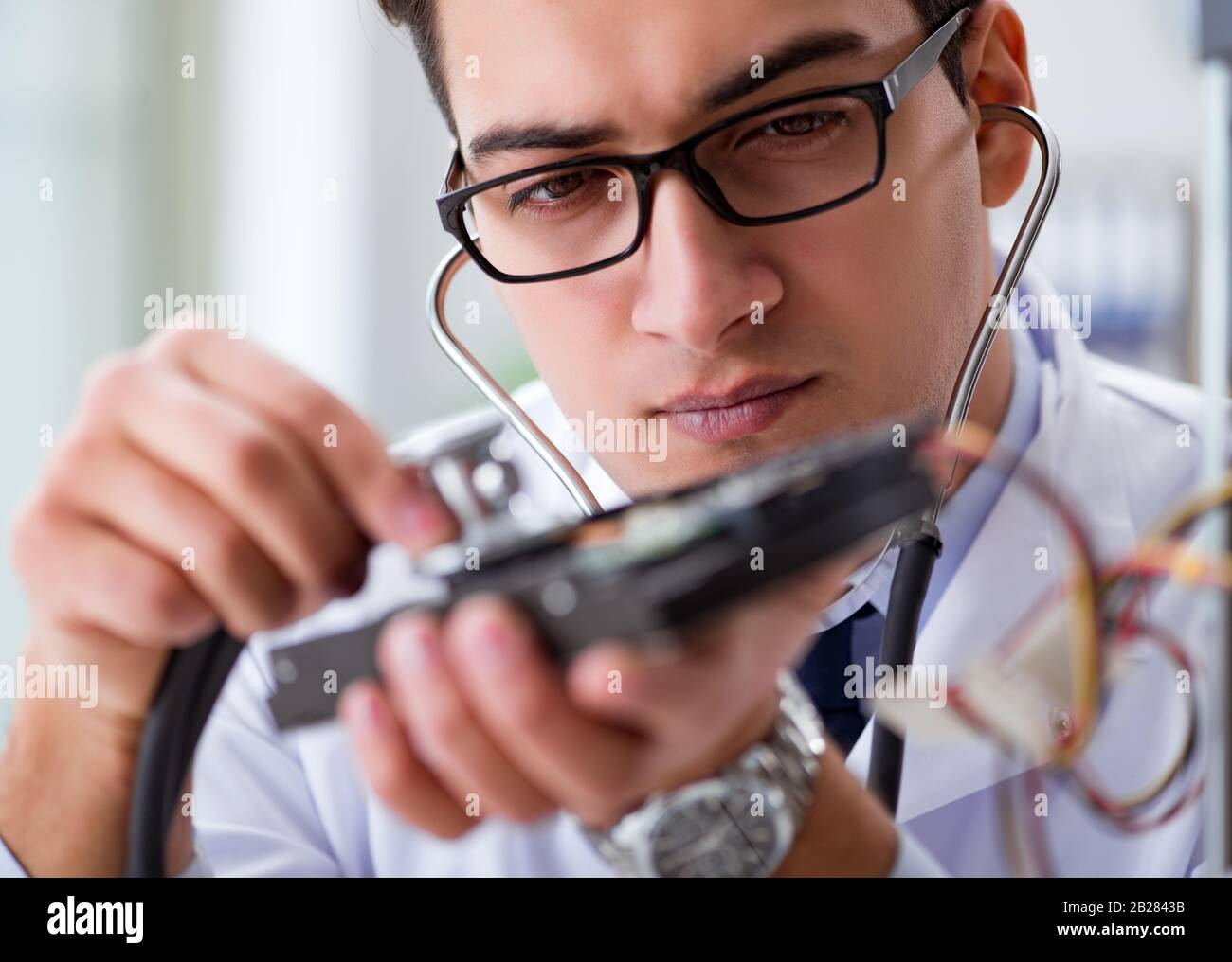 The proffesional repairman repairing broken hard drive Stock Photo - Alamy