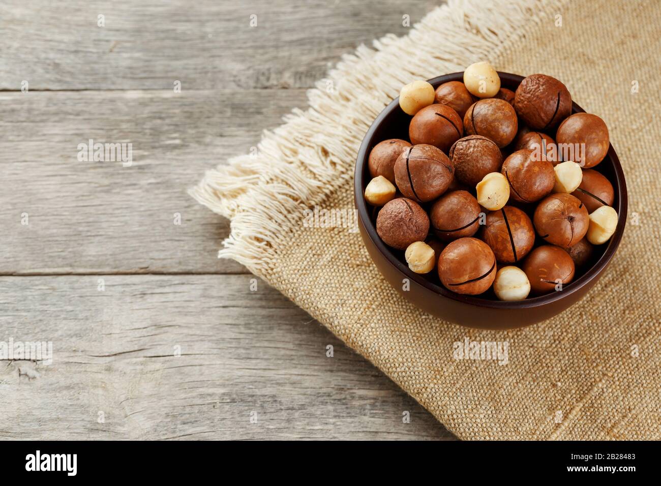 Macadamia nut on wooden background with vintage cloth, concept of ...