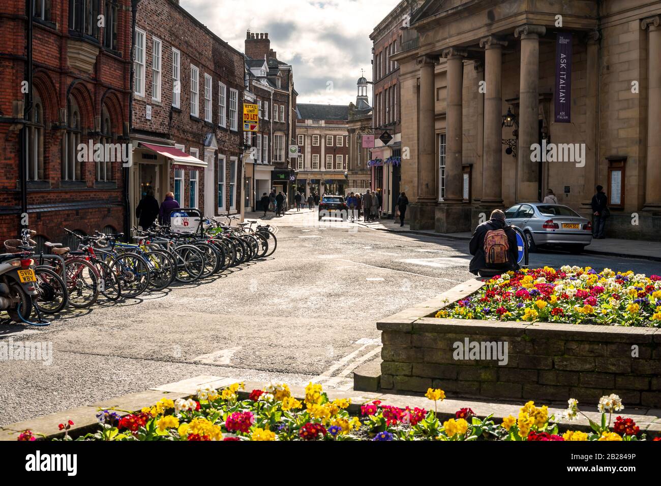 Blake Street in York. There is a flower bed in the foreground and a row ...