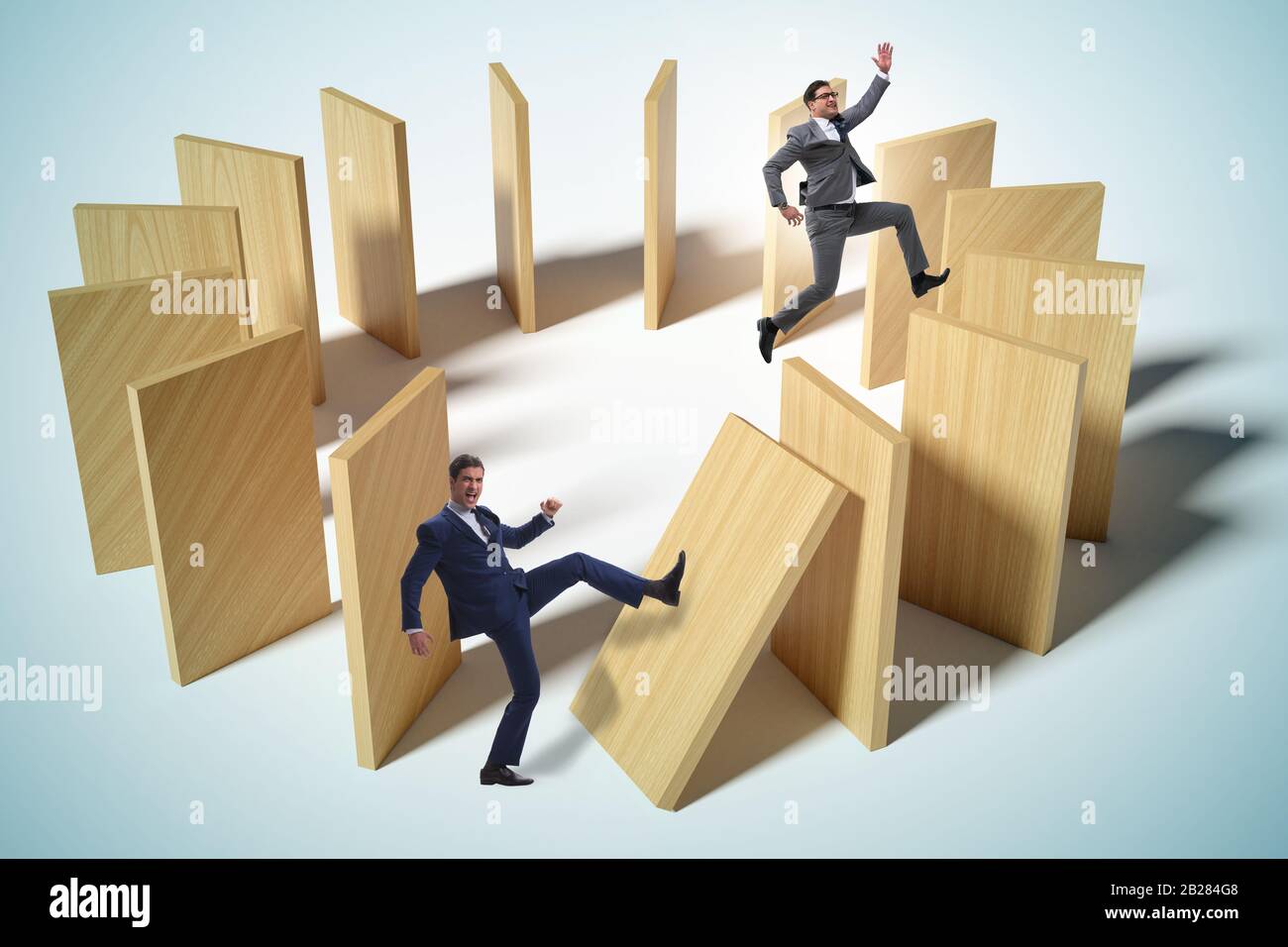 Domino effect and the competition concept Stock Photo - Alamy